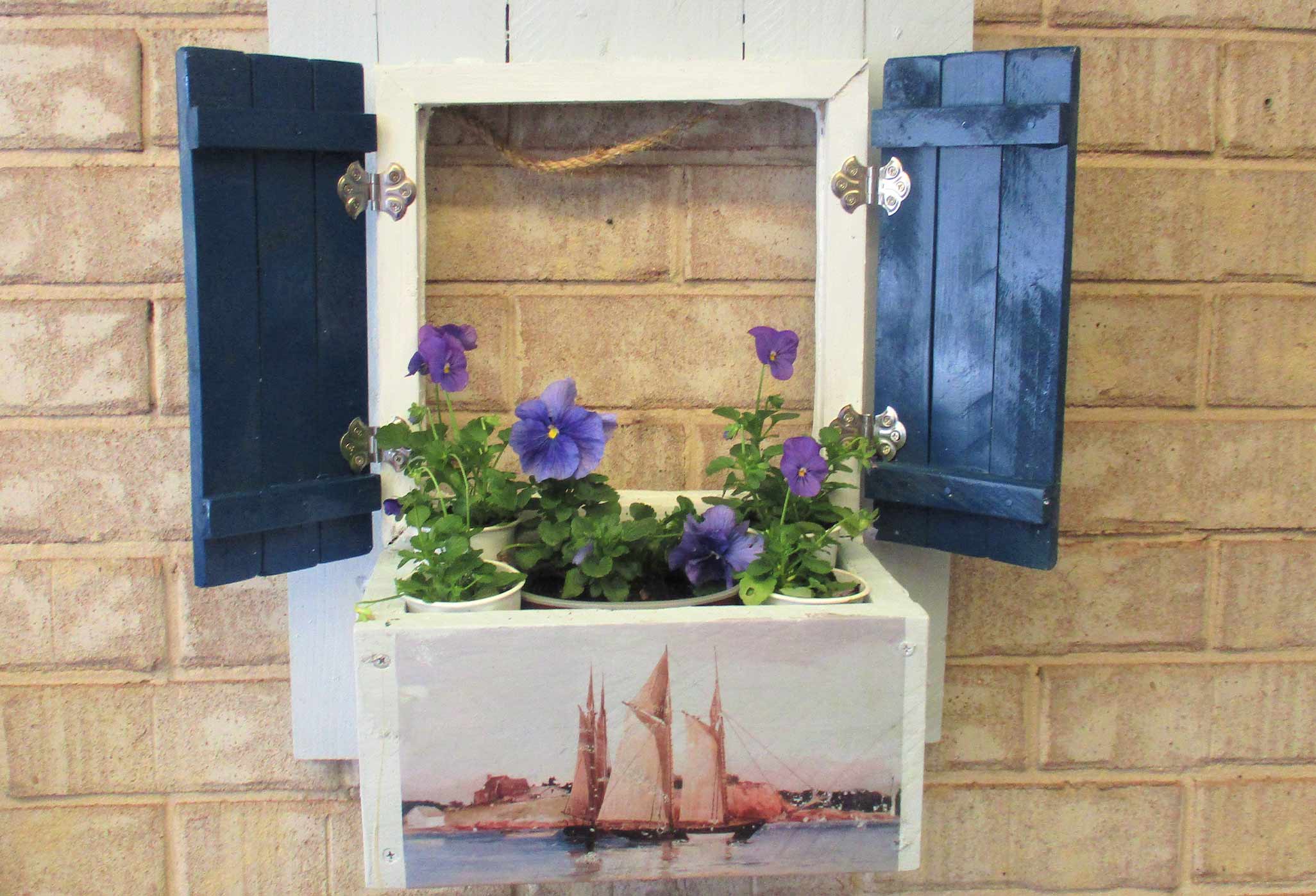 Sail boat dark blue shutters - The Flowering Potter